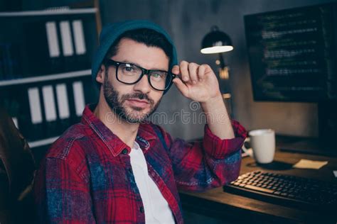 Photo Of Confident Thoughtful Programmer Wear Spectacles Coding Program Modern Device Indoors