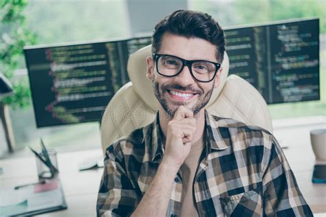 Photo Of Smart Clever Coder Dressed Eyewear Hand Arm Chin Working Modern Gadget Indoors