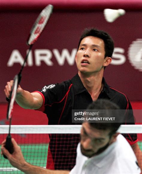 Singaporean Badminton Player Ronald Susilo Returns The Shuttlecock To