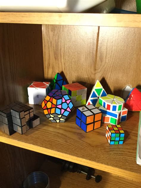 Colorful Rubiks Cubes On Wooden Shelf