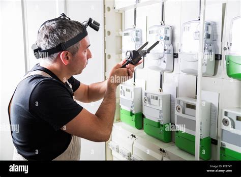Electrician Testing Equipment In Fuse Switch Box Close Up Stock Photo Alamy
