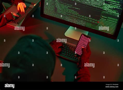 Anonymous People Using Computer And Programming To Break Code Cyber