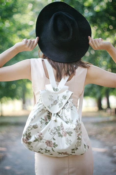 Portrait Of A Young Female Model From Back With Hat By Stocksy