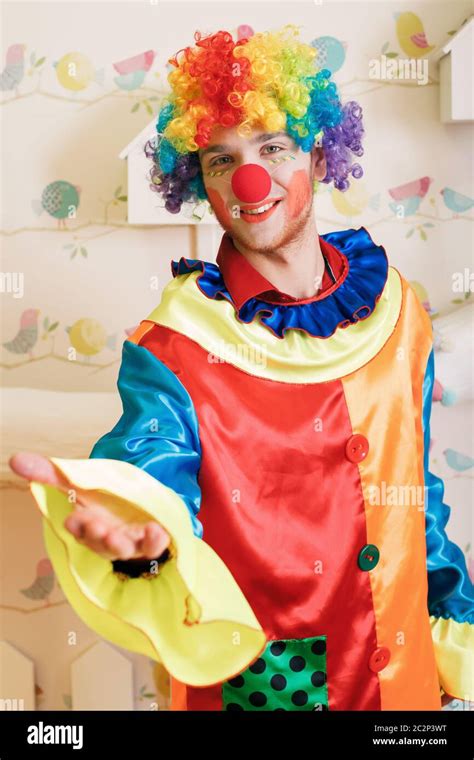 Happy Clown With Red Nose And Colourful Costume Offers Friendship Stock
