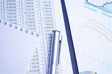 Premium Photo Data Analyzing In Stock Market On The Quotes Prints And A Pen