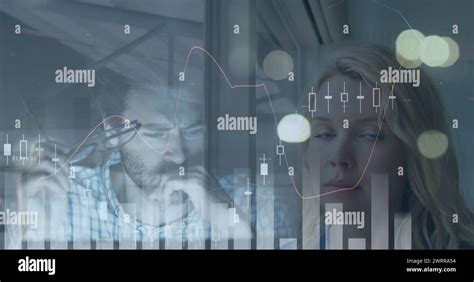 Statistical Data Processing Against Caucasian Man And Caucasian Woman At Office Business And