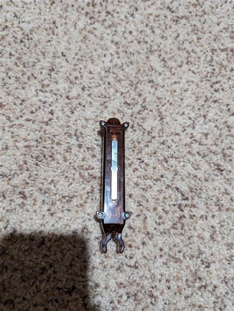 Telescoping Rectangular Brown Plastic And Metal Object Claw Like End