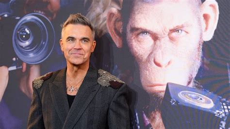 Boy 10 Meets Robbie Williams After Starring As Singer In New Biopic