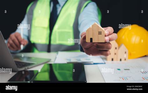 Architect Or Engineer Using Tablet To Work On Table Construction Planning Structural