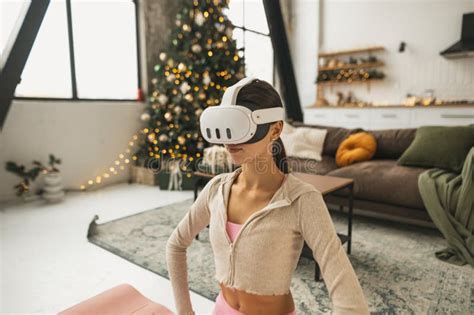 The Young And Gorgeous Lady Talks About Her Emotions Within A Virtual Reality Headset Stock