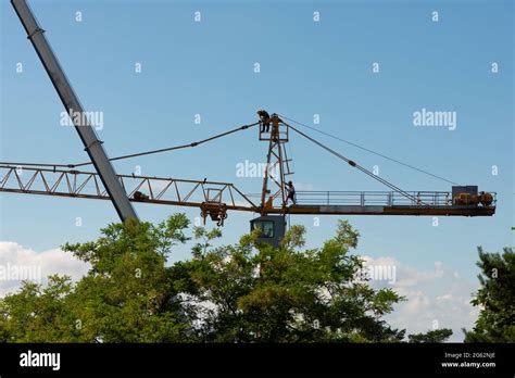 Tower Crane Assembly Builders Working On Construction Crane Stock