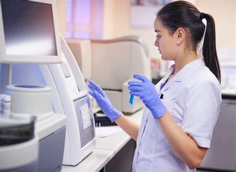 Quicker Results With Cutting Edge Lab Technology A Young Scientist Conducting A Medical Test In