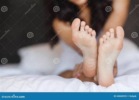 Beautiful Feet Lying In The Bed Of A Young Woman Stock Image Image