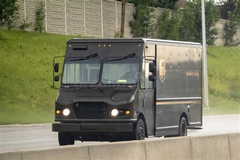 A Ups Delivery Truck Van On A Highway During Summer Editorial