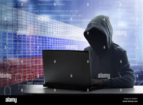 Russian Hacker At Laptop Malware And Virus Danger From Russia Man In