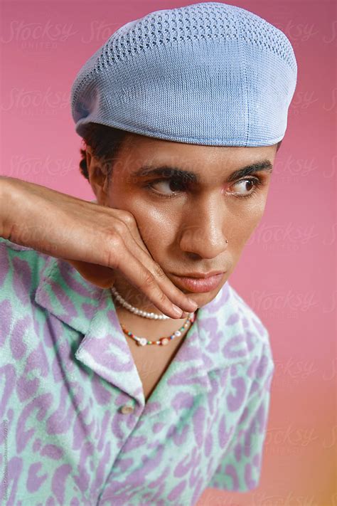 Young Latin Queer Man With Soft Eye Makeup And A Vibrant Outfit By Stocksy Contributor Edu
