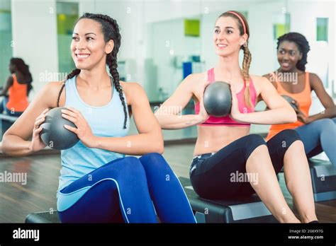 Beautiful Young Woman Exercising Russian Twist With Med Ball From