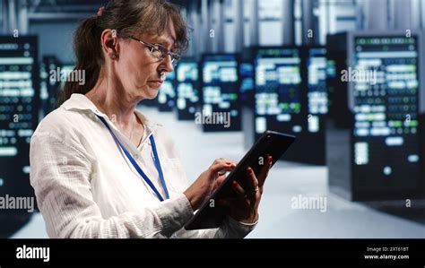 Octogenarian System Administrator Working In Data Center Housing Gpu Dedicated Server Rigs That