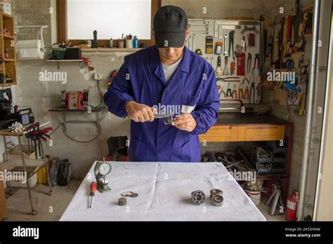 Hands Of A Mechanic Who In His Workshop Measures A Car Cross With A Caliber Precision Mechanics