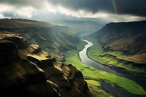 premium photo rainbow spanning across deep gorge wallpaper