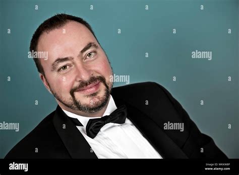 A Handsome Man With A Goatee Beard In A Black Suit Stock Photo Alamy A Handsome Man With A Goatee Beard In A Black Suit Stock Photo Alamy