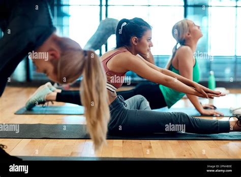 Shes Reaching For Her Fitness Goals A Group Of Attractive Young Women