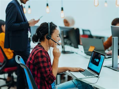 Group Of Multi Ethnic Colleagues Working On Desktop Computers Laptop And Sharing Their Ideas In