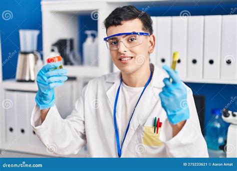 Young Non Binary Man Scientist Holding Urine Test Tubes At Laboratory Stock Image Image Of