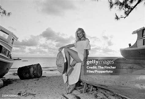 British Actress And Model Jilly Johnson Posing On A Beach Amidst
