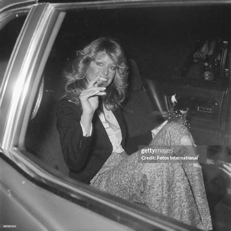 American Actress Farrah Fawcett Waves And Smiles From Her Car As She