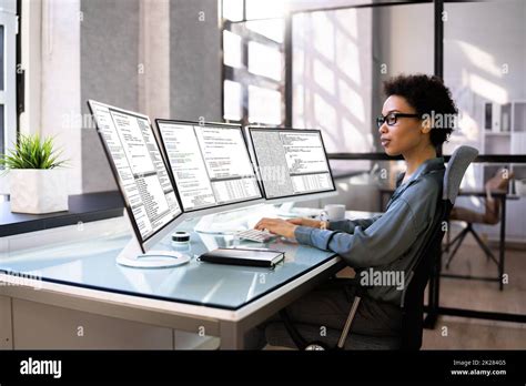 Female Web Programmer Coding On Computer Stock Photo Alamy