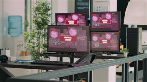 It Office With Multiple Monitors Showing Critical Error Message