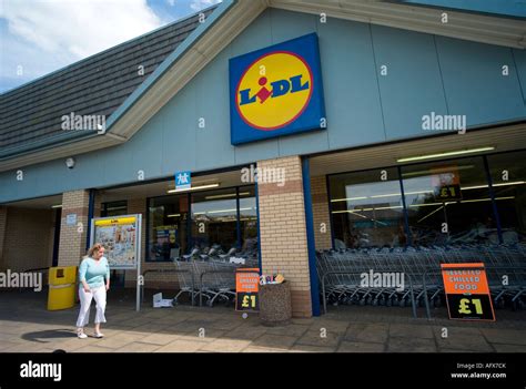 Lidl Discount Supermarket Exterior View With Woman Walking By Stock Photo Alamy