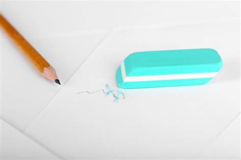 Premium Photo Eraser And Pencil On Paper Background