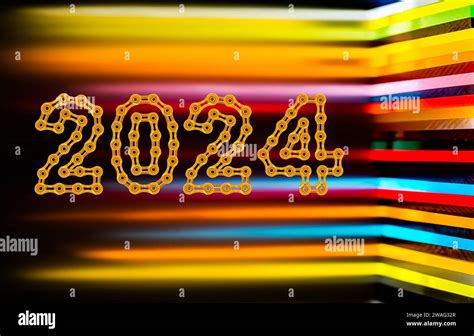 Light Through Stack Of Different Colours Cast Acrylic Sheet On Black Background With 2024 Happy