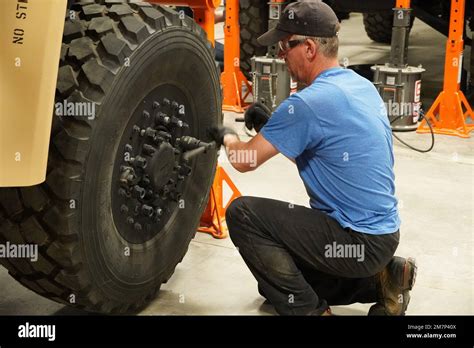 A Student Taking The Jltv Phase Ii Course Tightens The Tire Lug Nuts A Student Taking The Jltv Phase Ii Course Tightens The Tire Lug Nuts