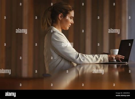 Female Developer Working On A Laptop In A Coworking Space Professional