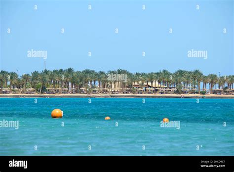 Yellow Buoys Floating On Sea Surface As Marker For Swimming Restriction In Deep Water At