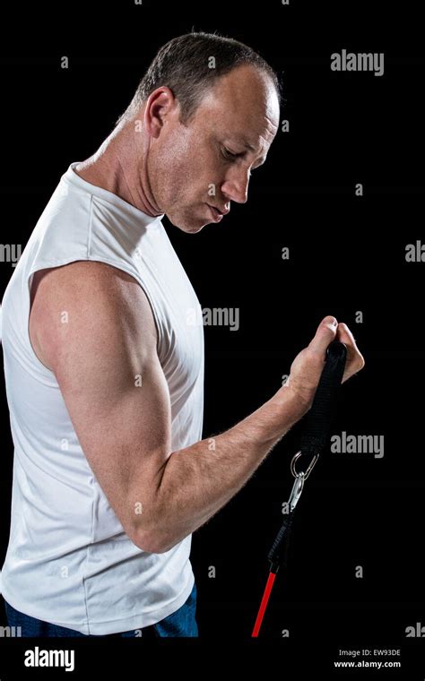 Bicep Curl Exercise With Resistance Band Studio Shot Over Black Stock