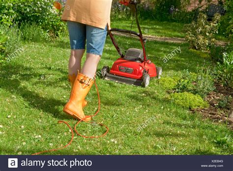 Mature Lady Mowing Lawn High Resolution Stock Photography And Images Alamy
