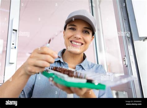 Woman With Kit Of Tools Installing Aluminium Window Stock Photo Alamy