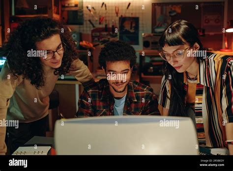 Group Of Young People Developing New Computer Program They Watching