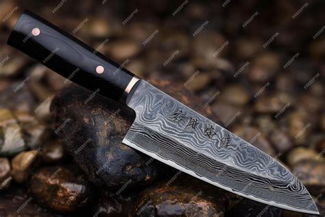 A Professional Photo Of An Expensive Japanese Damascus Kitchen Knife With A Black Handle Resting