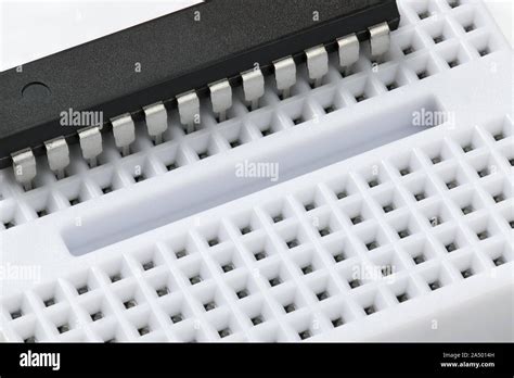 Breadboard And Microchip Closeup Electronic Component For Digital Equipment Concept For