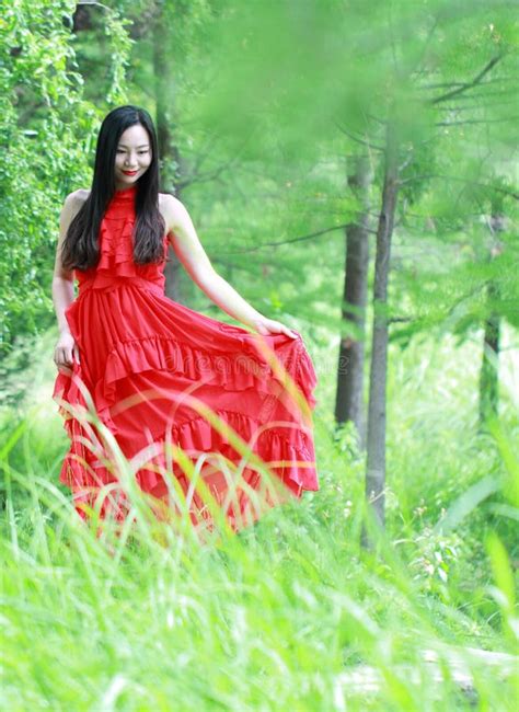 Asian Chinese Young Girl Walk In Forest Enjoy Peaceful Life Stock