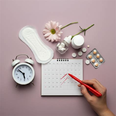 Premium Photo A Person Is Writing A Notepad With The Date Of The Month