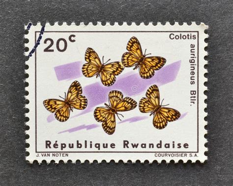 Cancelled Postage Stamp Printed By Rwanda That Shows African Golden Arab Editorial Photo