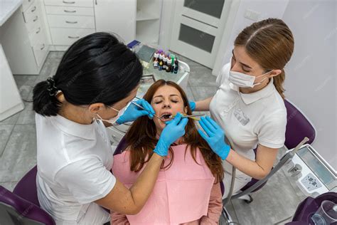 Premium Photo Female Dentist And A Female Assistant In A Special