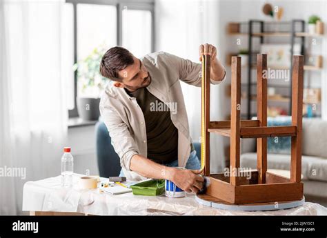 Man With Ruler Measuring Table For Renovation Stock Photo Alamy