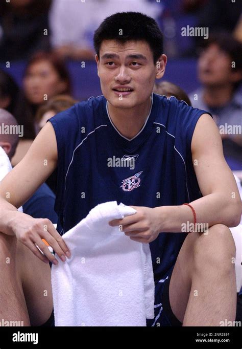 Yao Ming Of The Houston Rockets Watches From The Bench During An Nba Basketball Game Monday